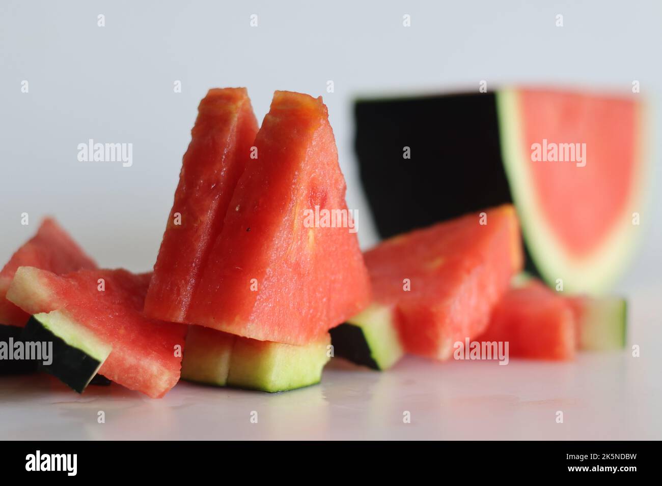 Fresh watermelon slices in different shapes. Wedge shape and triangle ...
