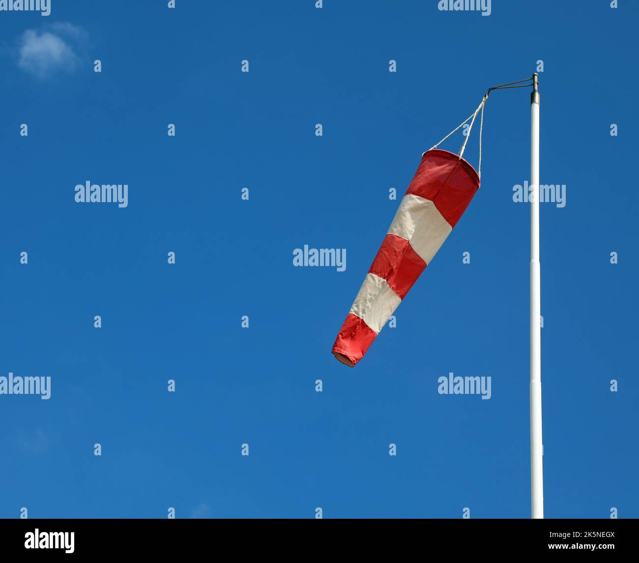 weather vane in white and red to indicate the direction of the wind and ...