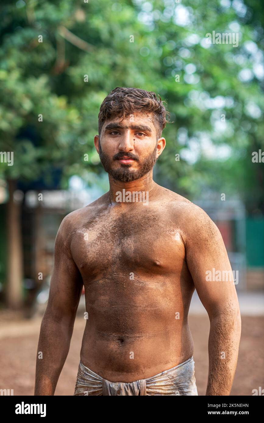 Portrait of a wrestler covered with mud at a kushti akhara (wrestling ...