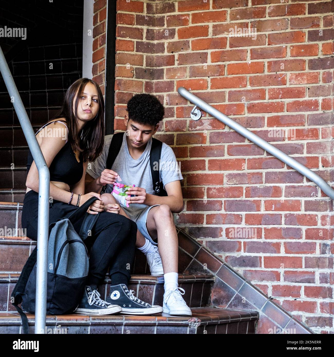 Epsom Surrey UK, October 09 2022, Young Couple Boy And Girl Sitting And ...