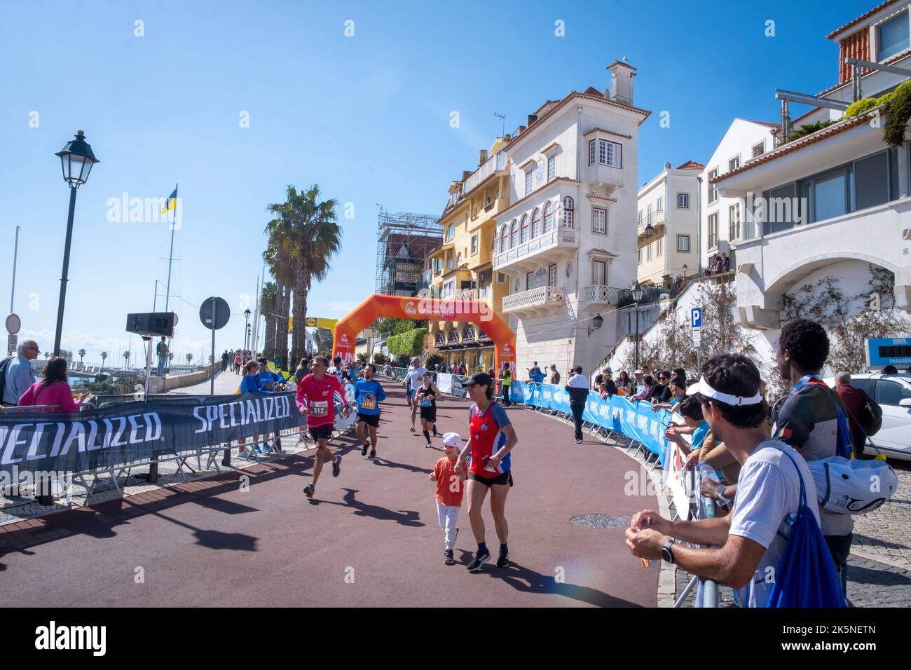 Runners and spectators at a marathon in Cascais, Portugal Stock Photo ...