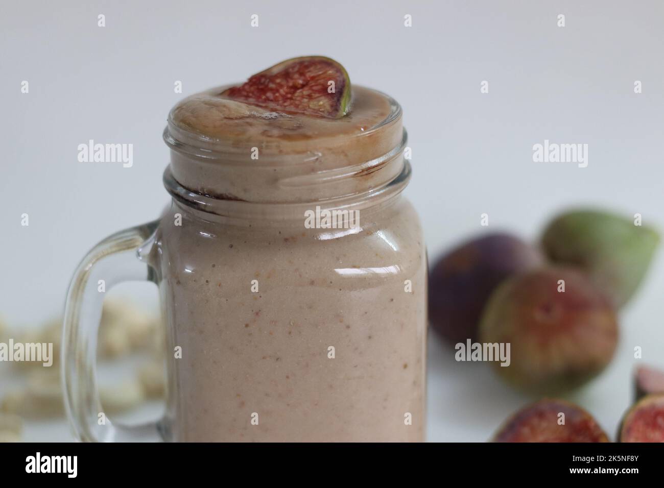 Fig Smoothie. Summer drink made of fresh fig in cashew milk, served in ...