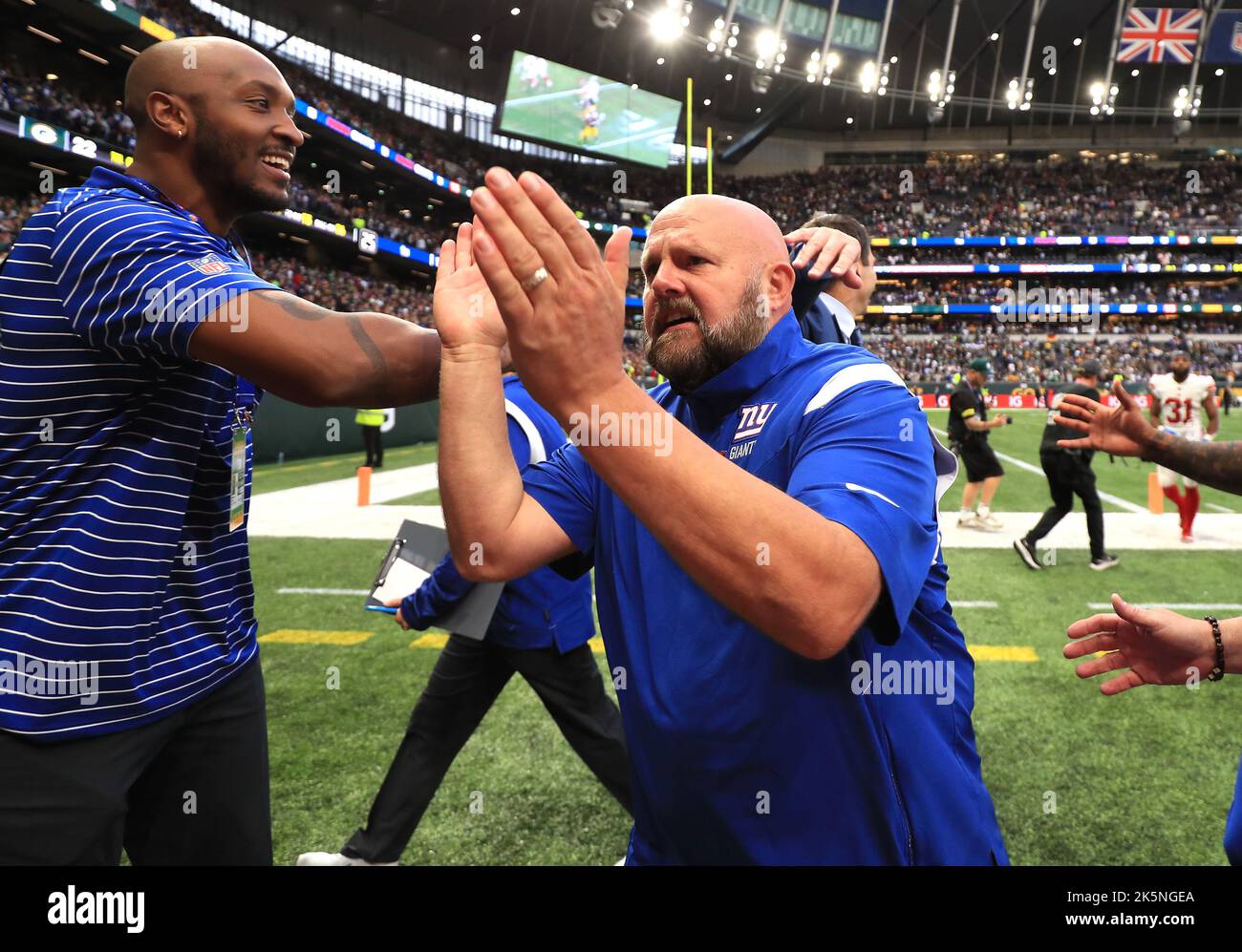 New York Giants head coach Brian Daboll (centre) celebrates victory ...