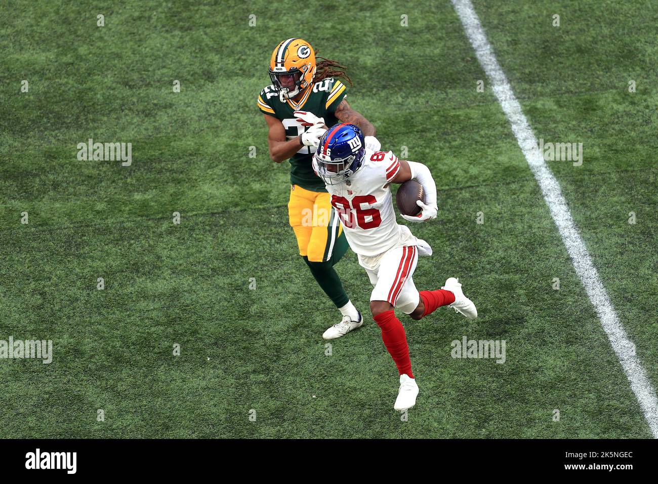 New York Giants' Darius Slayton holds off the tackle from Green Bay ...
