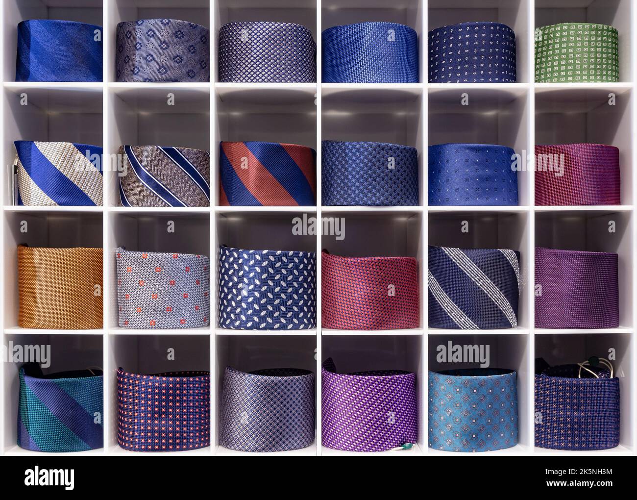 Showcase with multicolored ties. View of different colors ties in ...