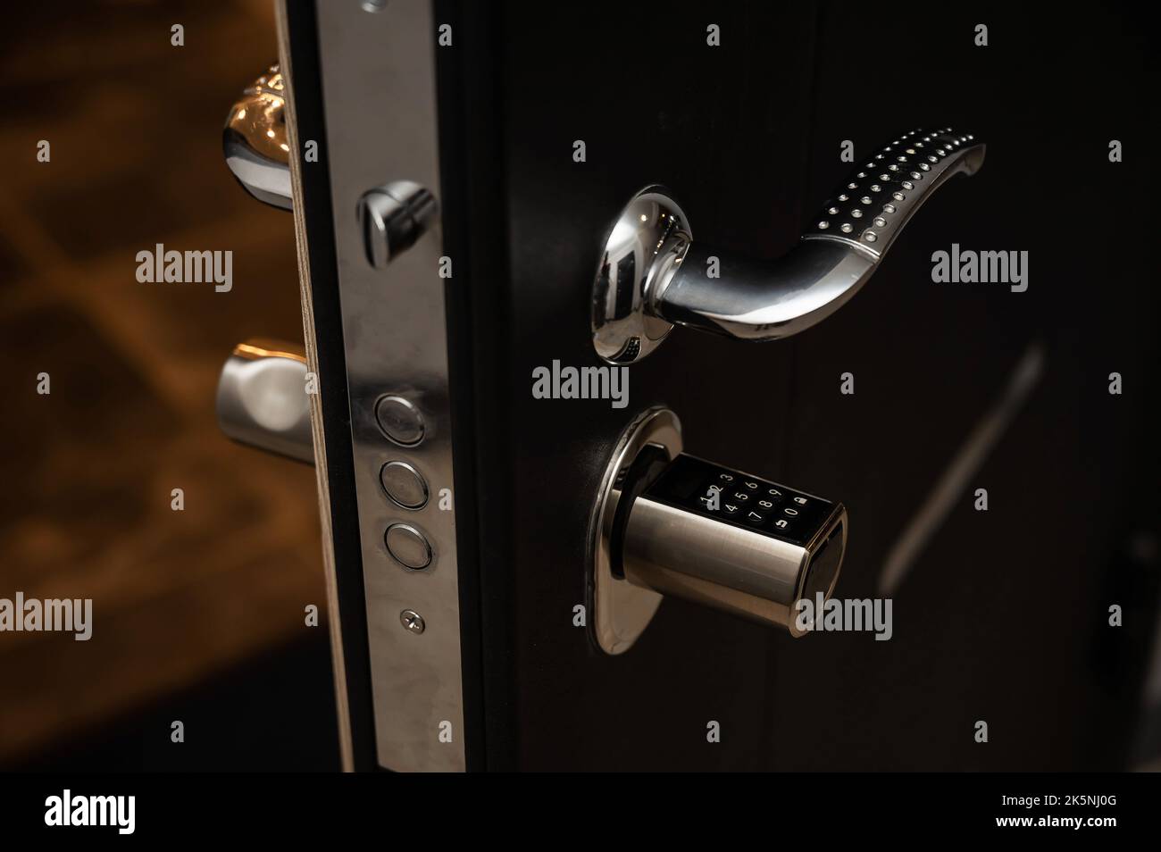 Open door to the apartment with a combination lock. Keyless entry Stock ...