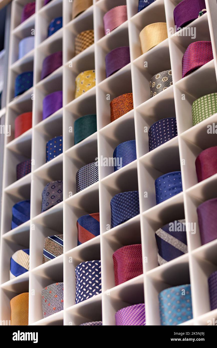 Showcase with multicolored ties. View of different colors ties in ...