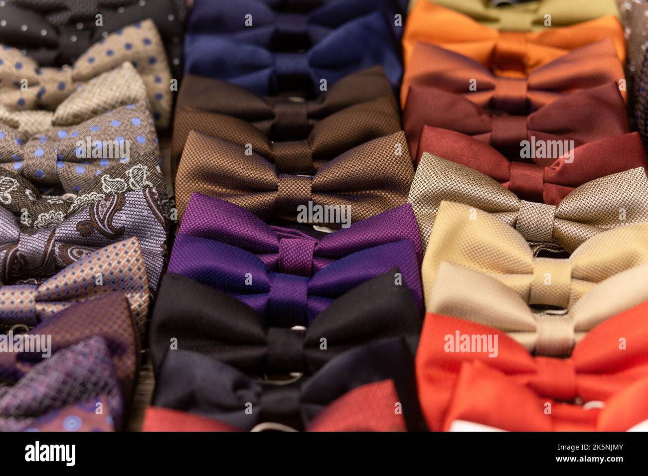 Showcase in a store with beautiful multi-colored bow ties. Many bright ...