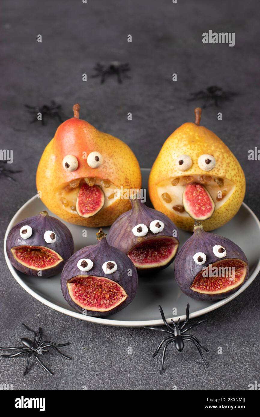 Spooky pear and fig monsters for Halloween party on gray background ...