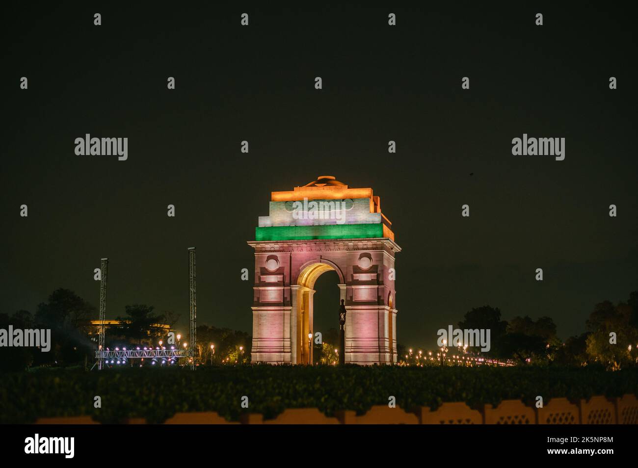 A majestic shot of the India Gate at Night (Kingsway) illuminated at ...