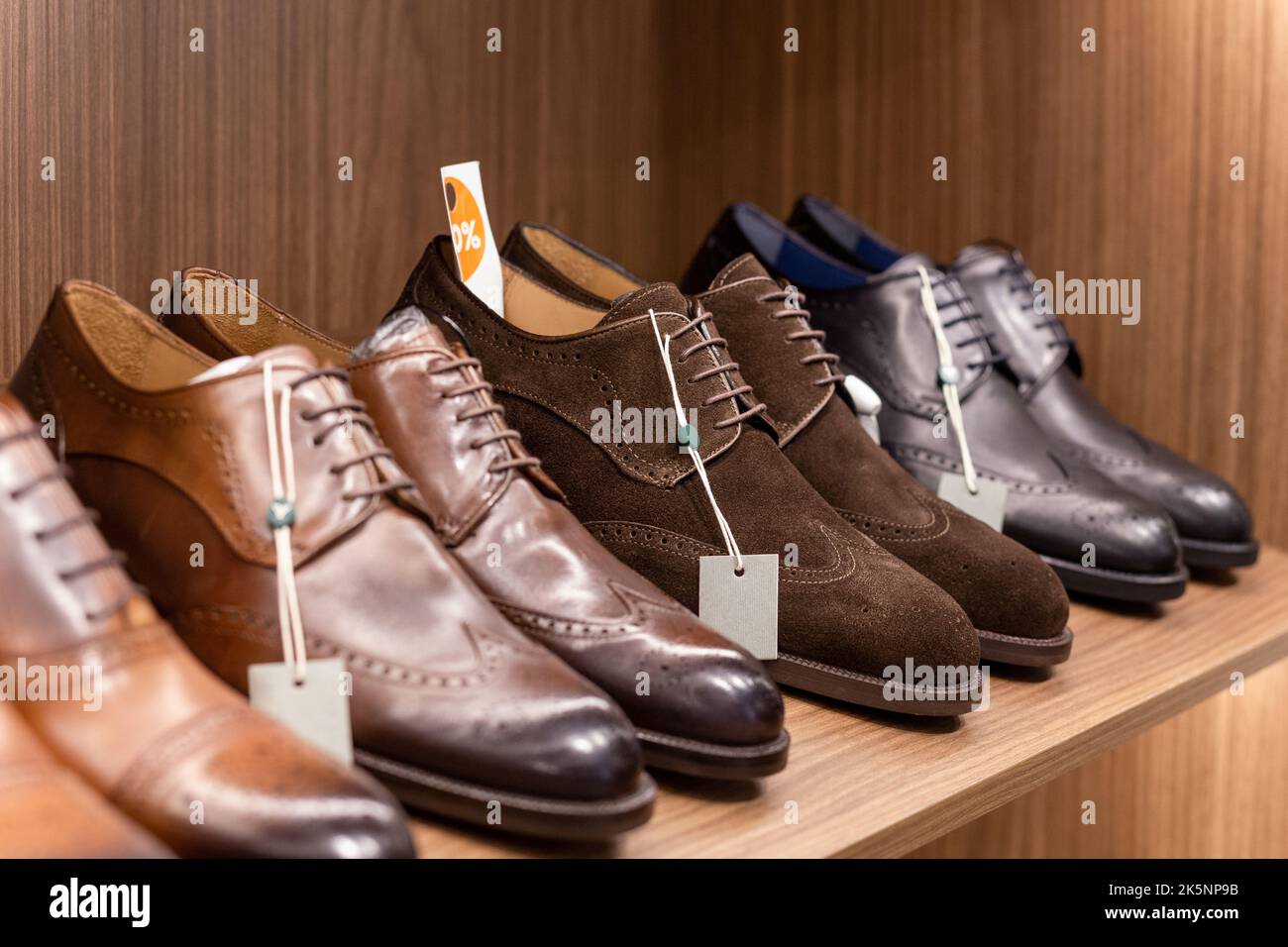 Leather shoes were lined up on the store shelves. Men elegant shoes in ...