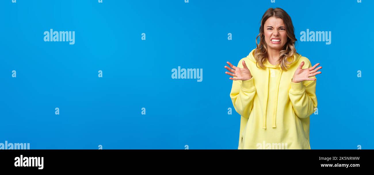 Young woman describing disgusting story, grimacing from aversion and ...