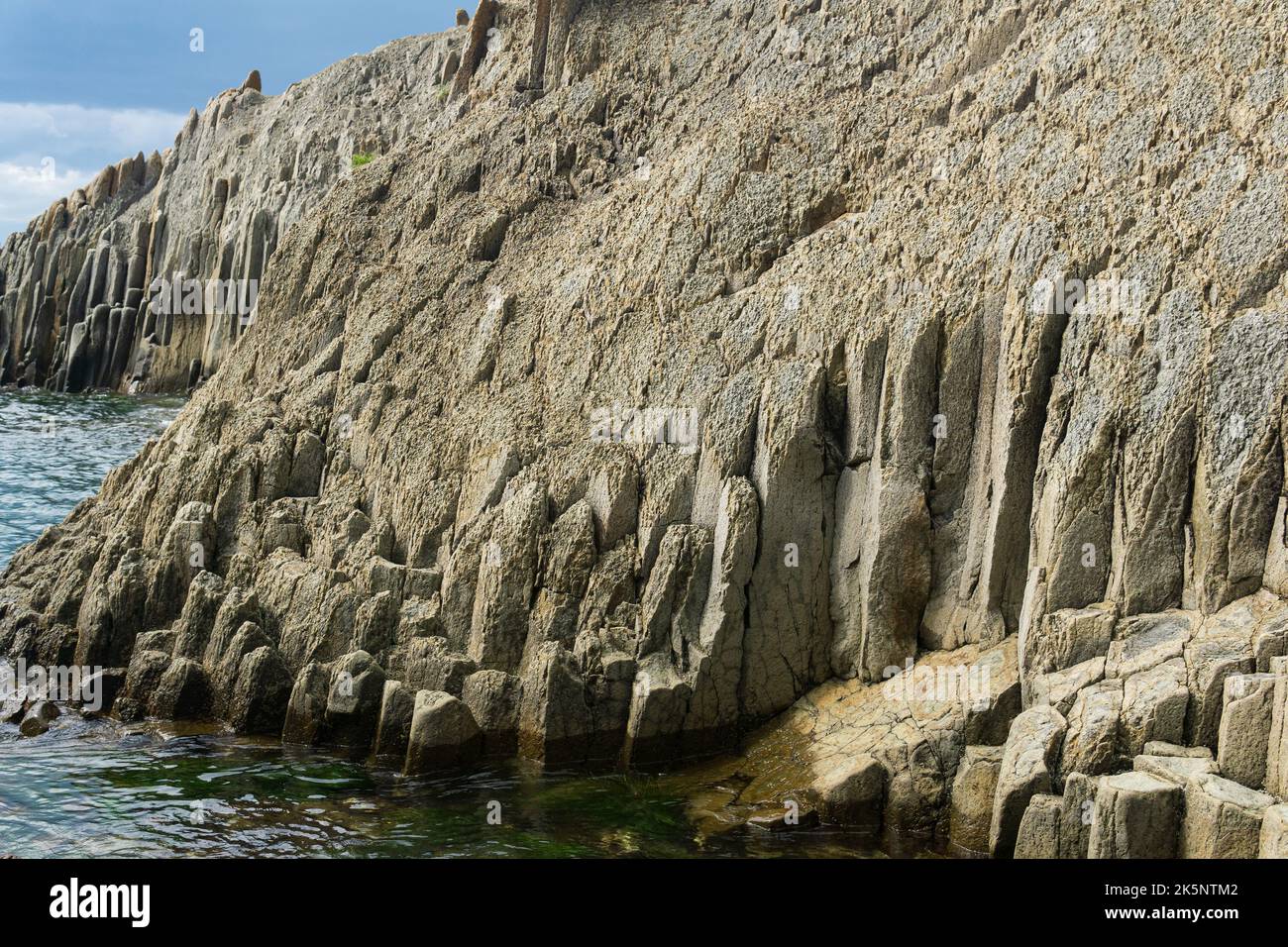 natural landscape with a sheer cliff folded columnar basalt on the ...