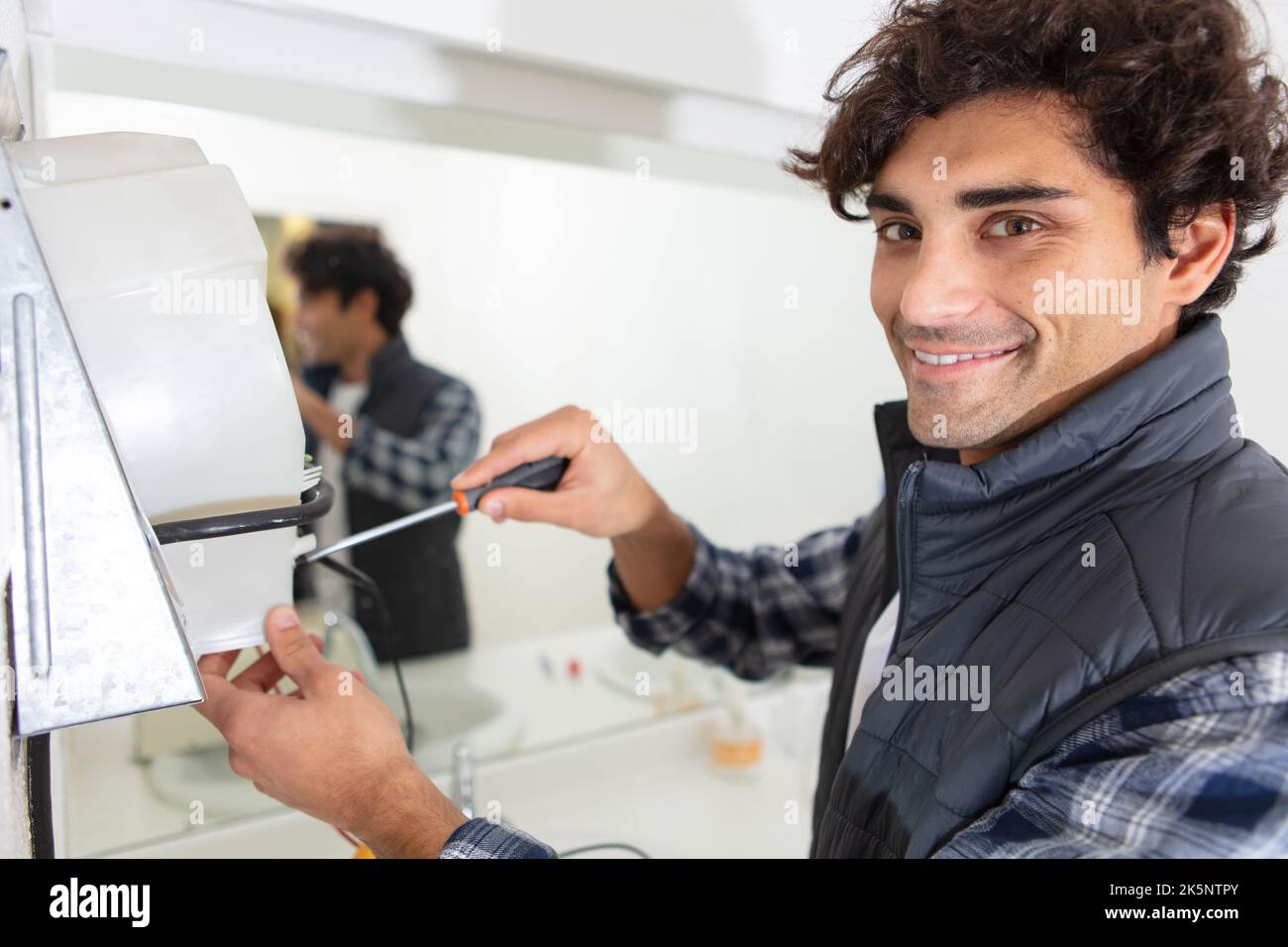 Man adjusting air hose on hi-res stock photography and images - Alamy