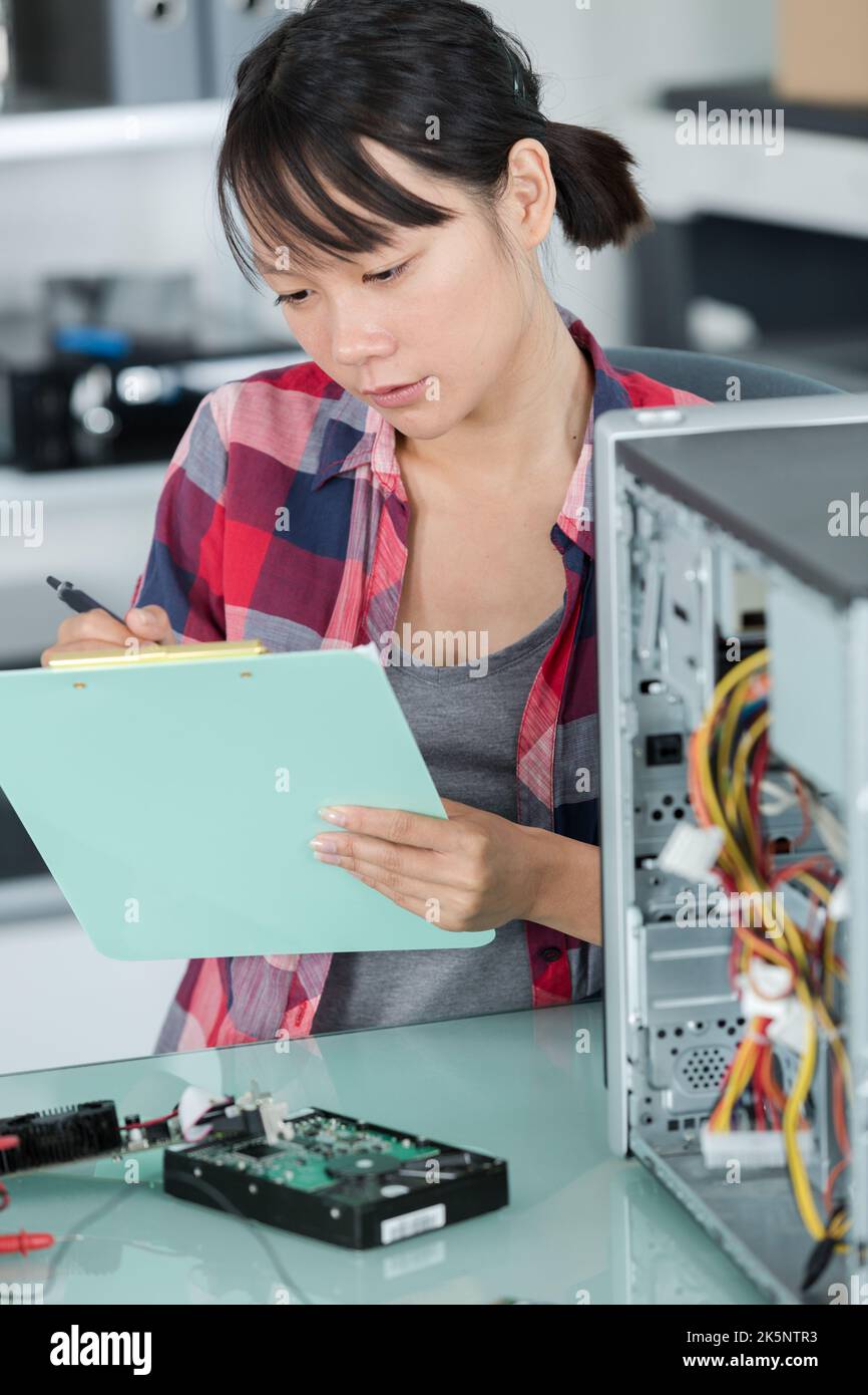 female technician repairing a computer Stock Photo - Alamy