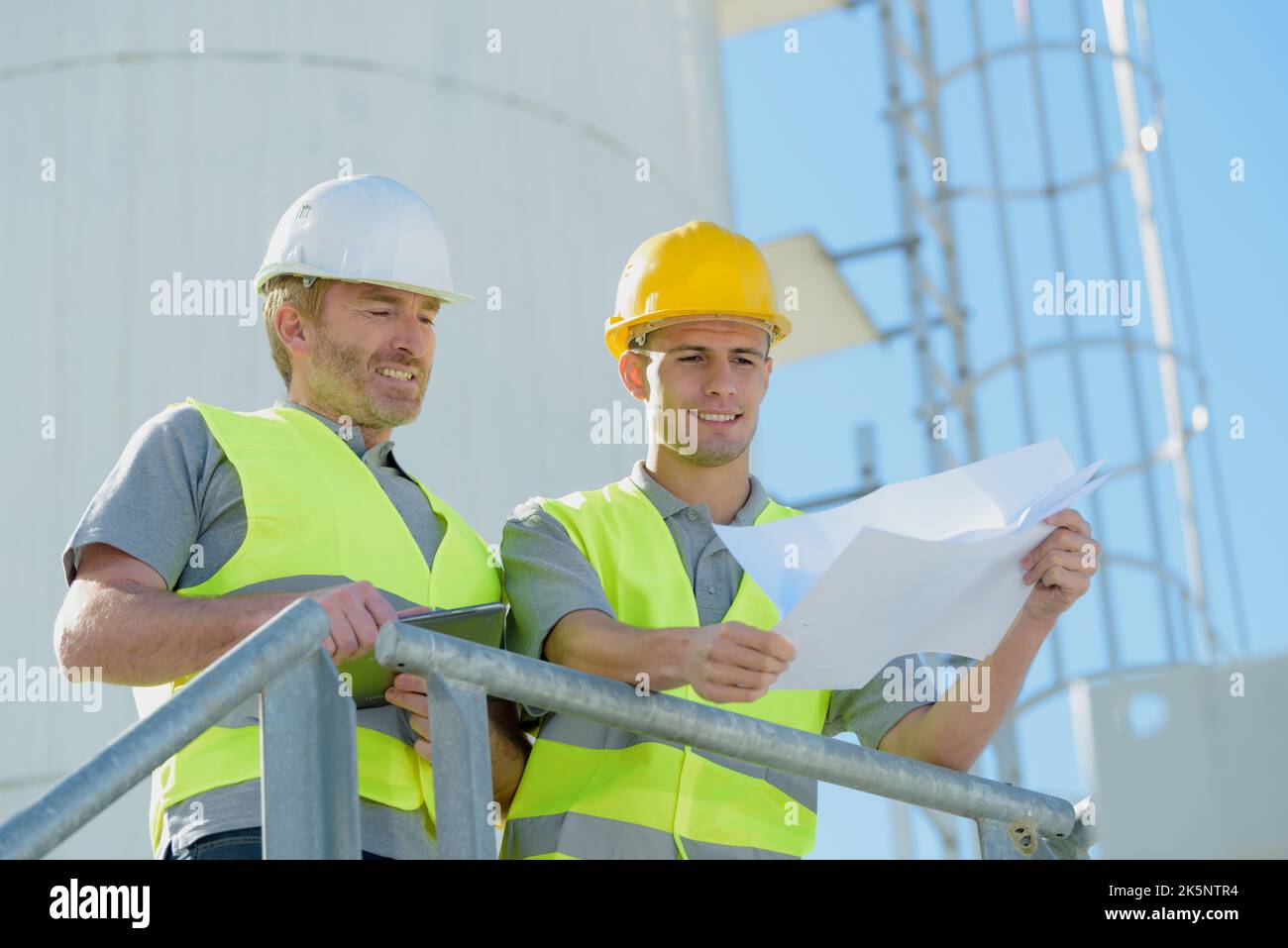 engineers looking into the factory from the outside Stock Photo - Alamy