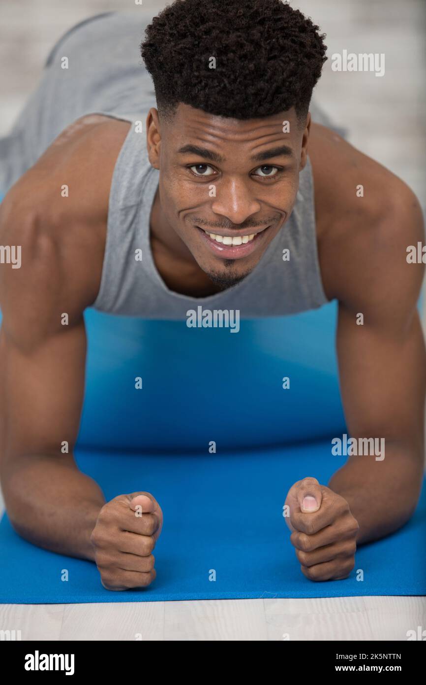 muscular man in plank position Stock Photo - Alamy