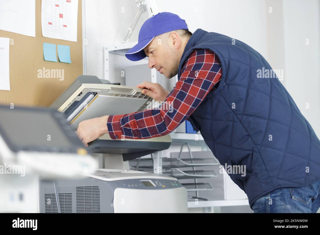 technician repairing an office photocopier Stock Photo - Alamy