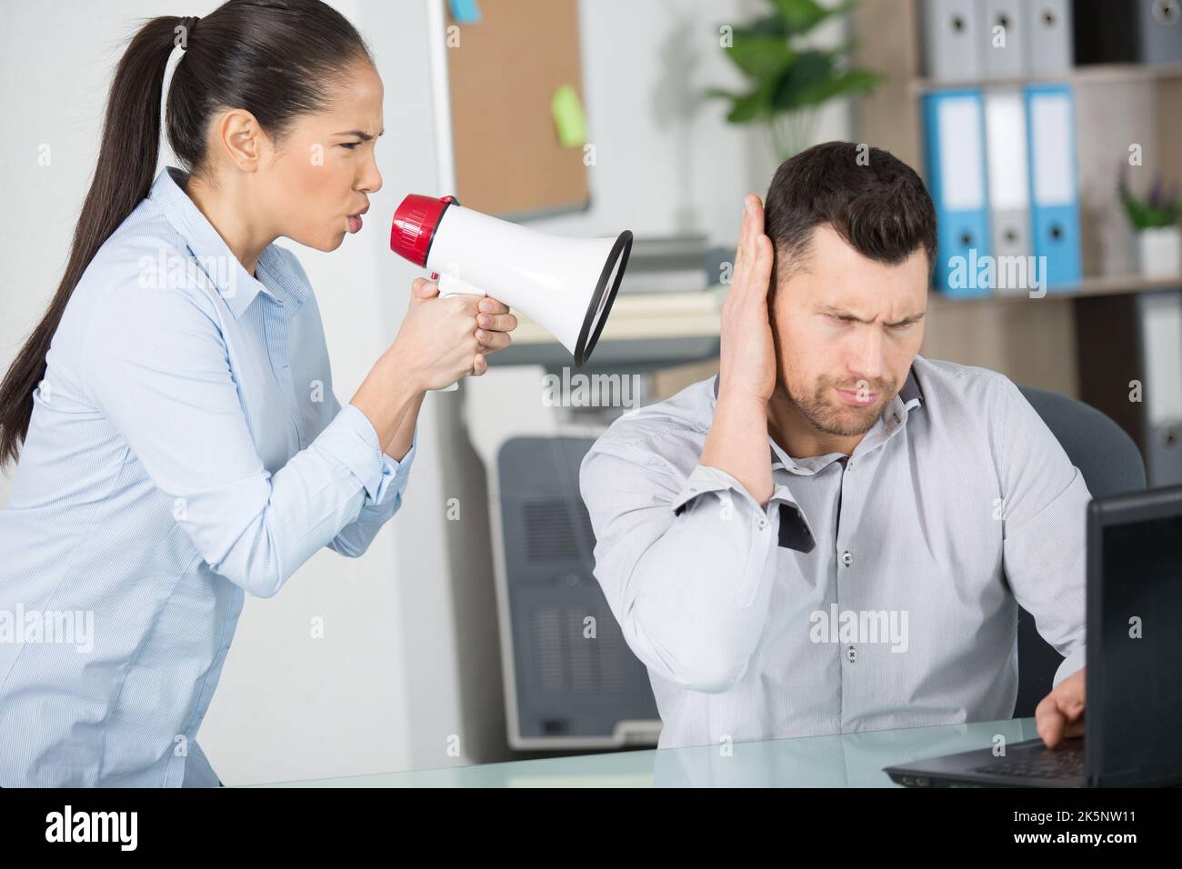 female boss yelling at young male employee in the office Stock Photo ...