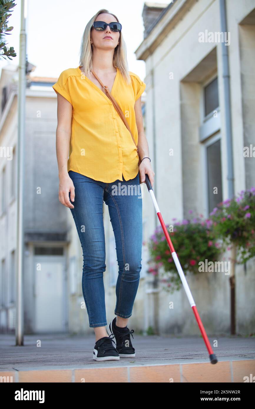 blind woman walking on sidewalk Stock Photo - Alamy