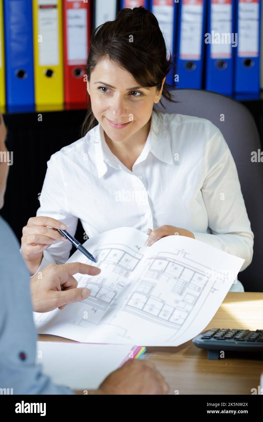 architect in office drawing on blueprint Stock Photo - Alamy