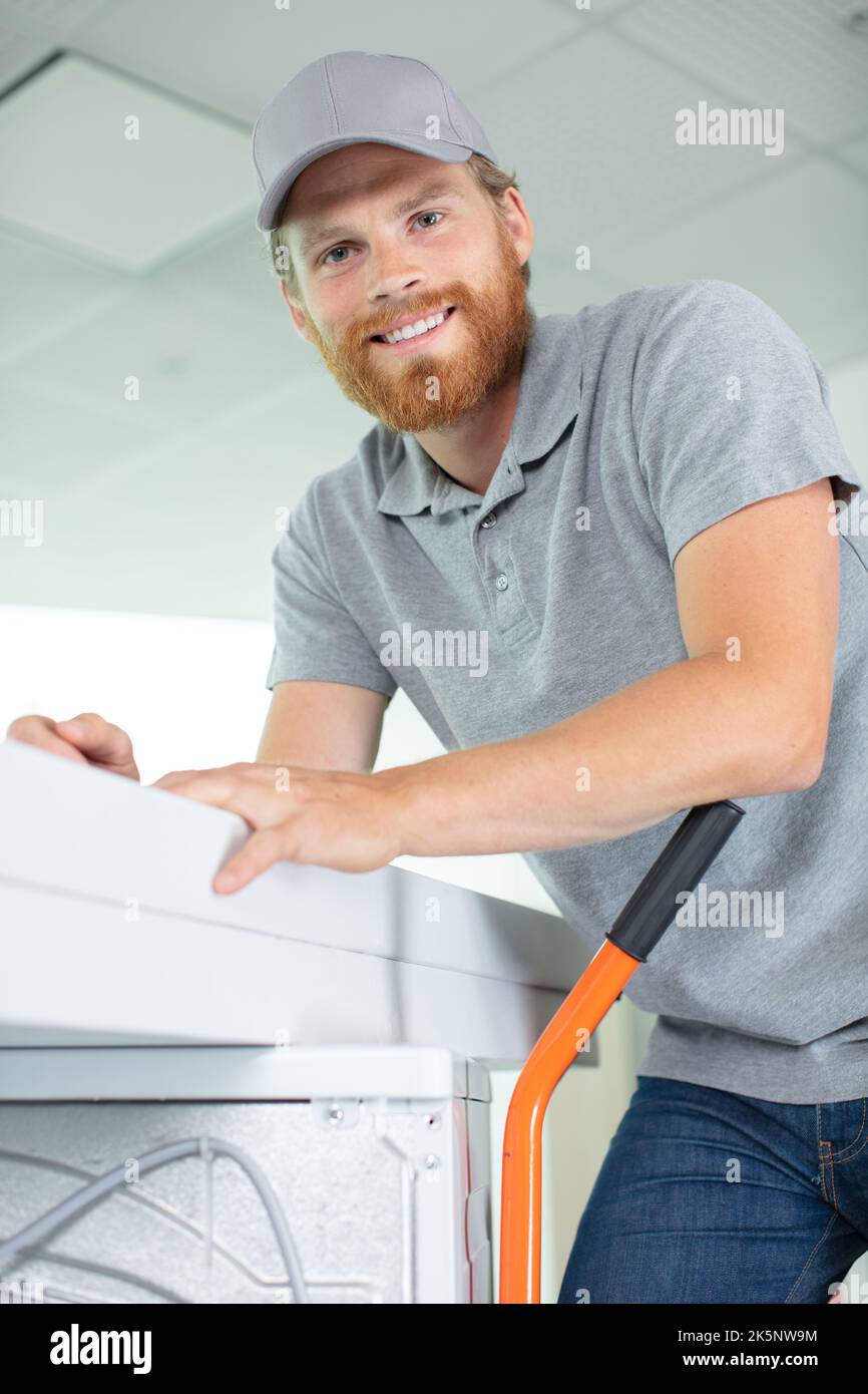 Carrying washing machine hi-res stock photography and images - Alamy