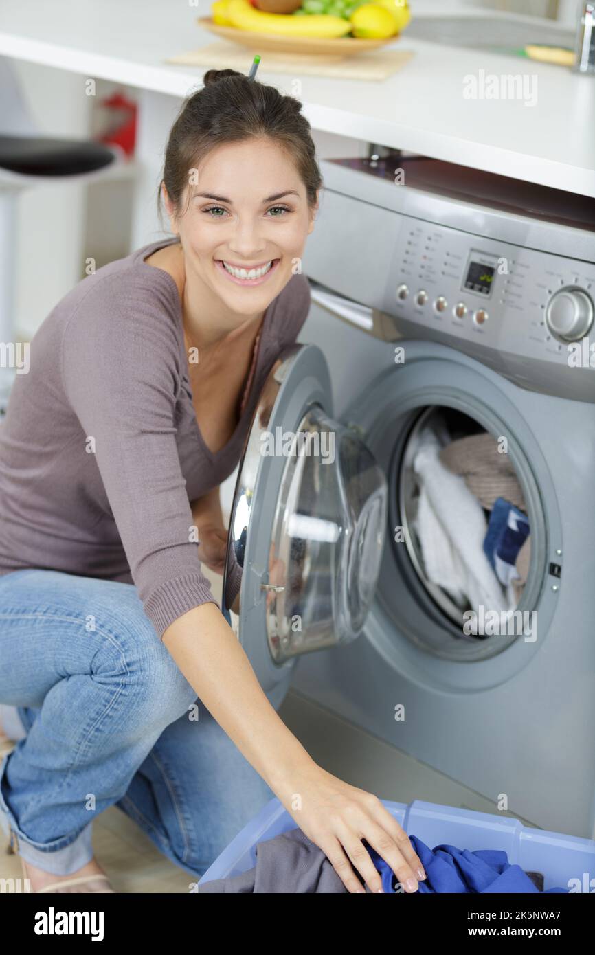 happy housewife woman in laundry room Stock Photo - Alamy