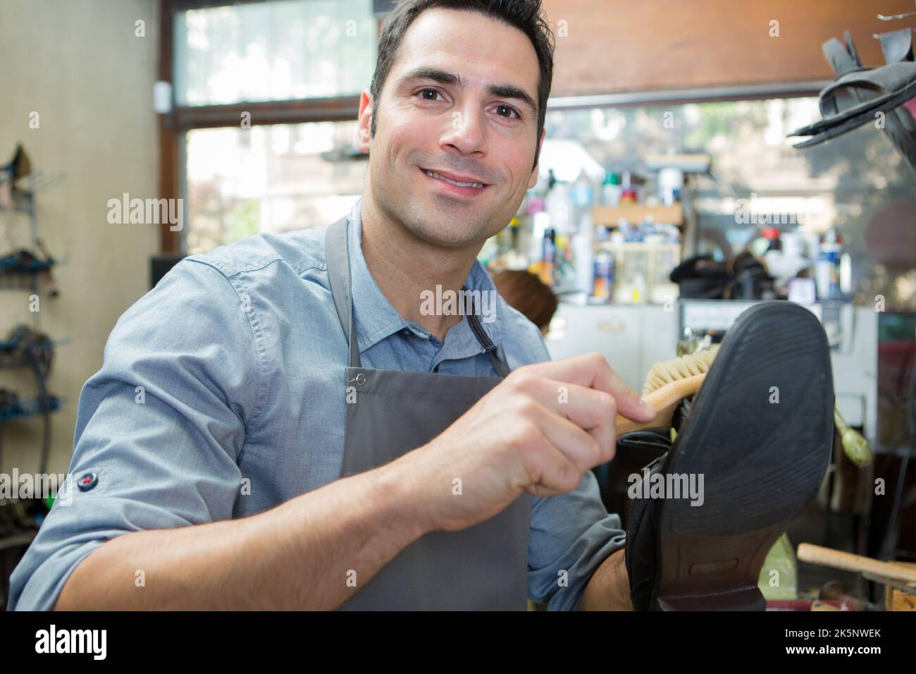 Man cleaning shoes hi-res stock photography and images - Alamy