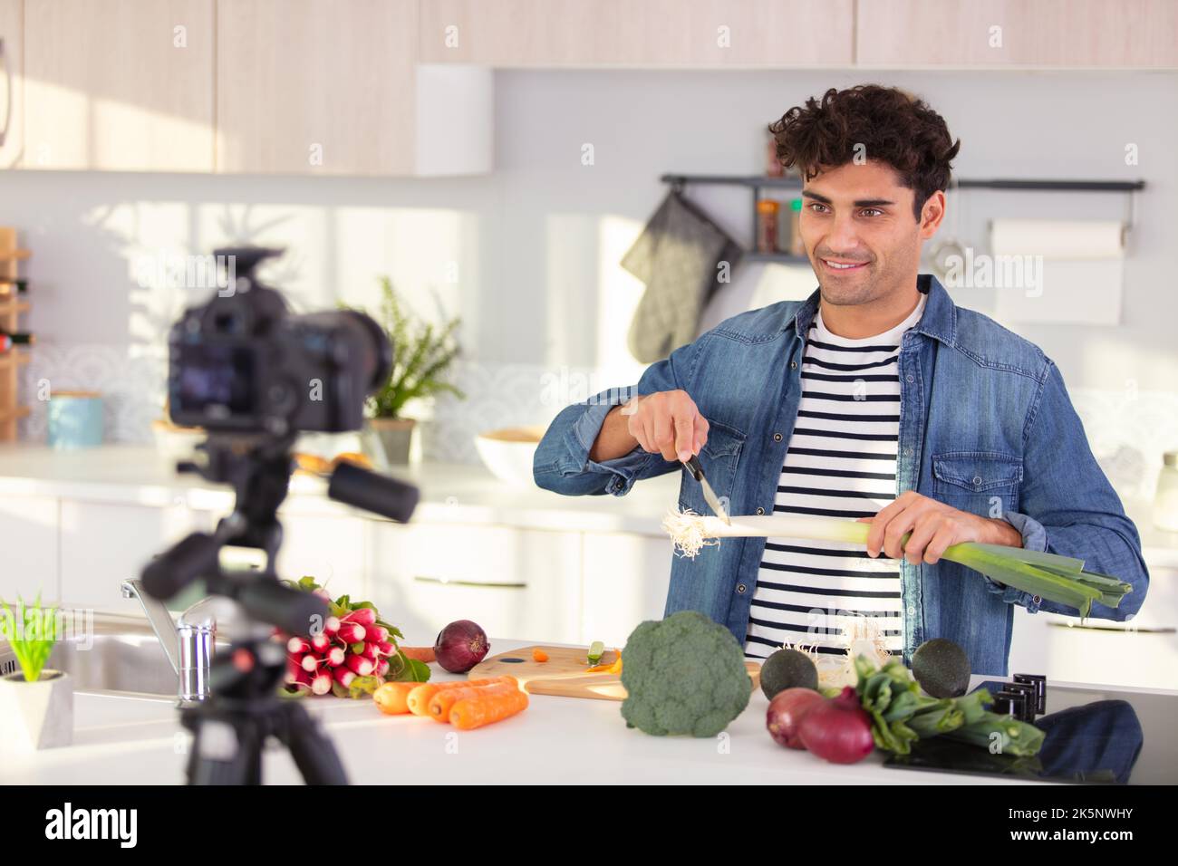 Young chef filming cooking hi-res stock photography and images - Alamy