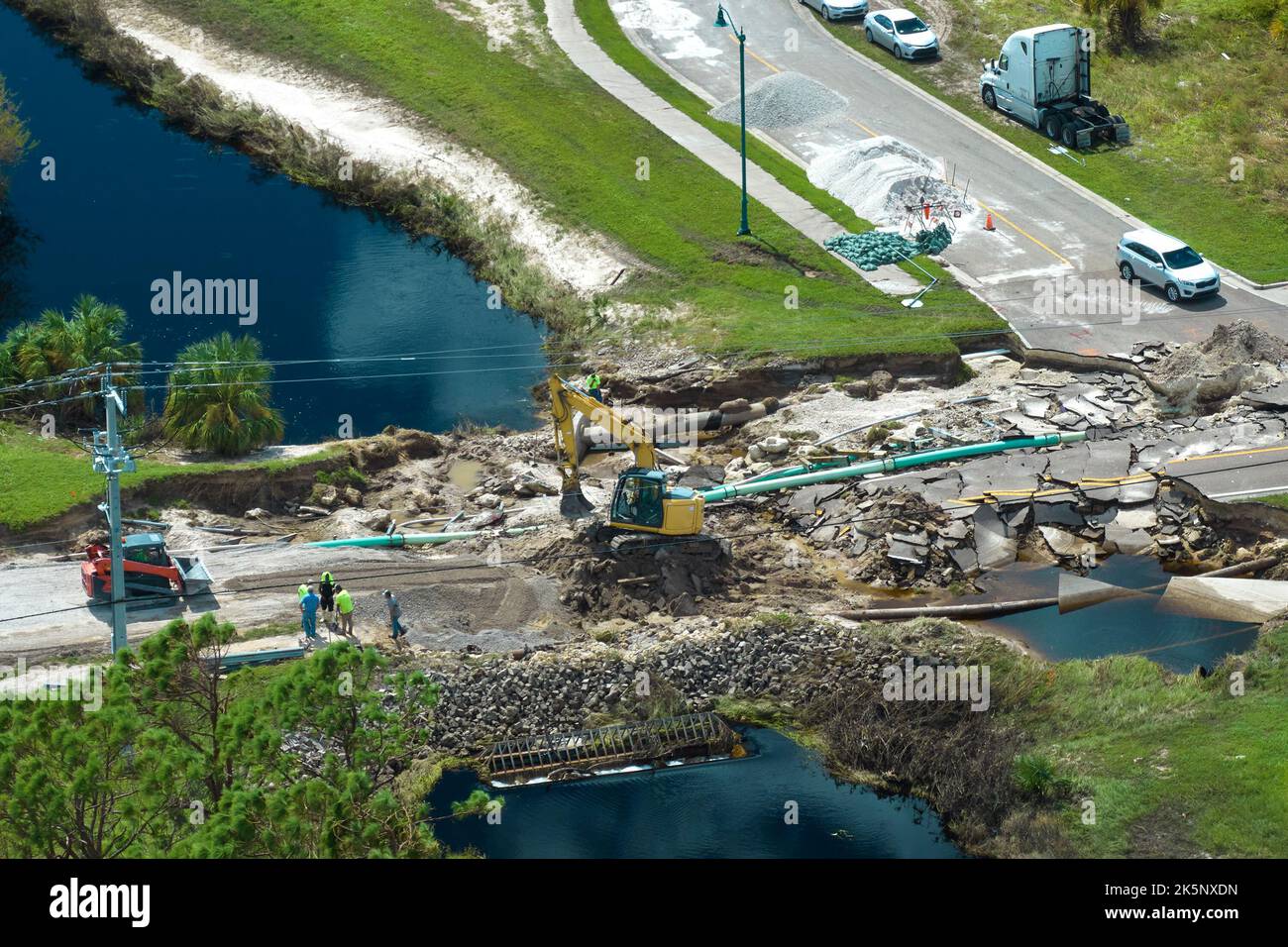 Aerial view of reconstruction of damaged road bridge destroyed by river ...