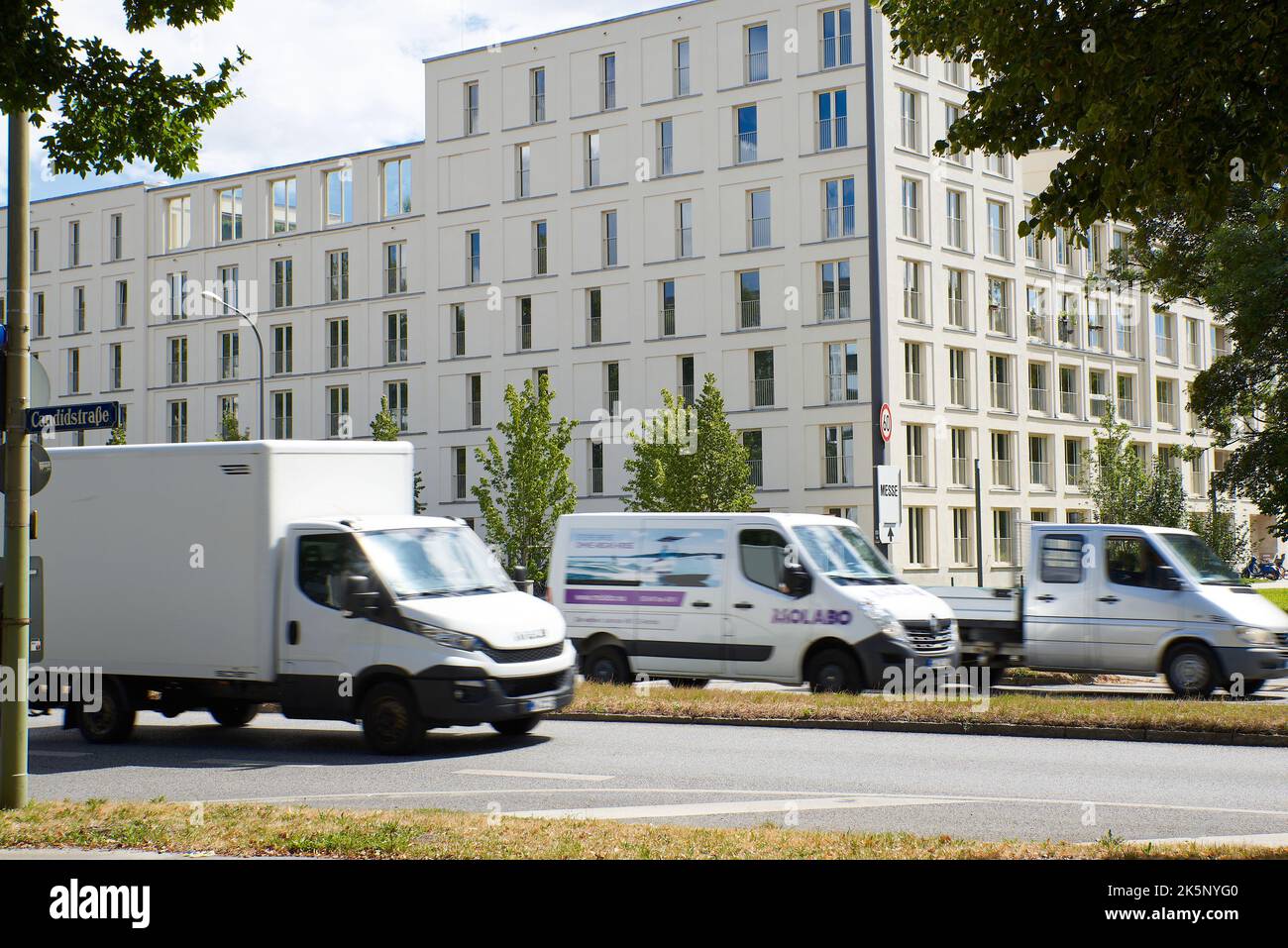 Traffic Middle Ring / Candidstraße. Three Staggered White Panel Vans ...