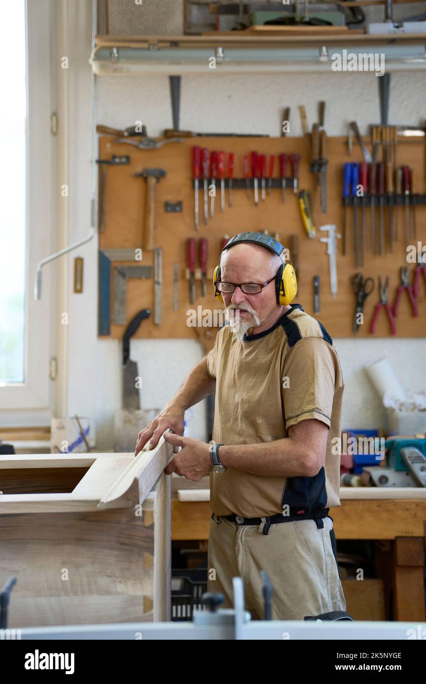 Antique Carpenter Checks In Workshop Accuracy Of Fit Of A Plinth Panel ...