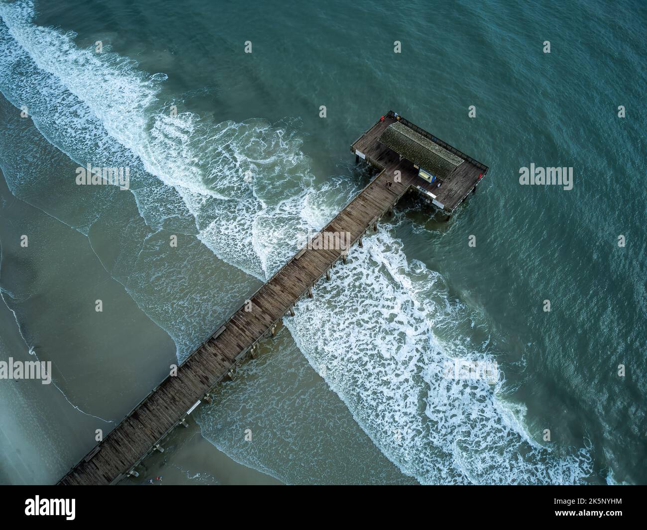 Fishing dock and waves from above Stock Photo - Alamy