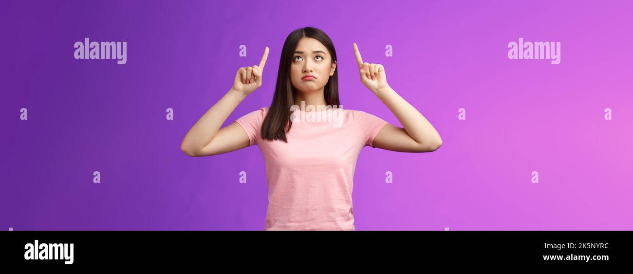 Sad disappointed sulking asian girl with short dark haircut, look ...