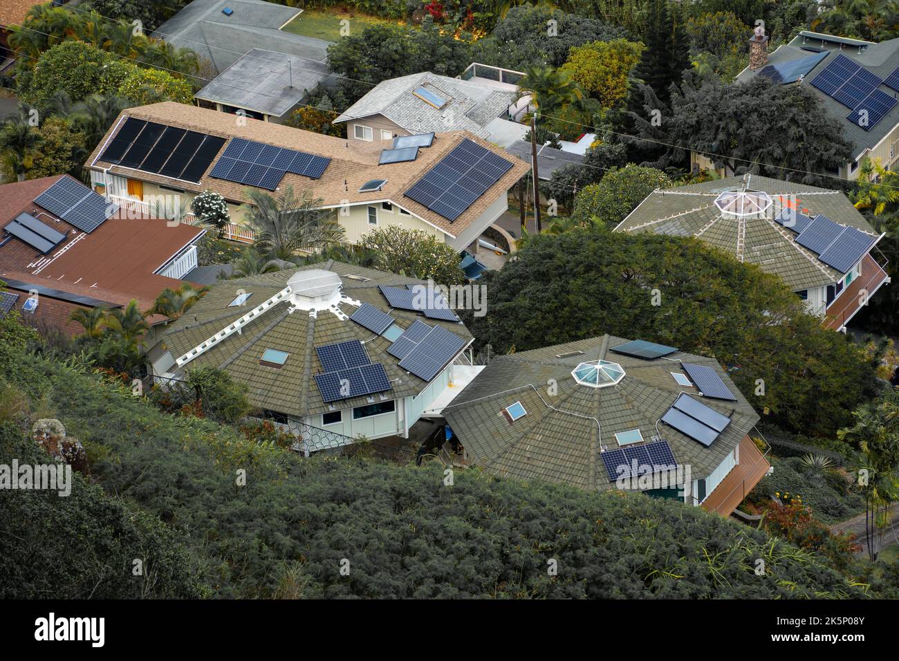 An aerial view of circular buildings with energy solar panels on their ...