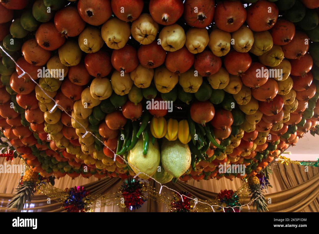 View of the traditional ritual hut decorated with fruits and vegetables ...
