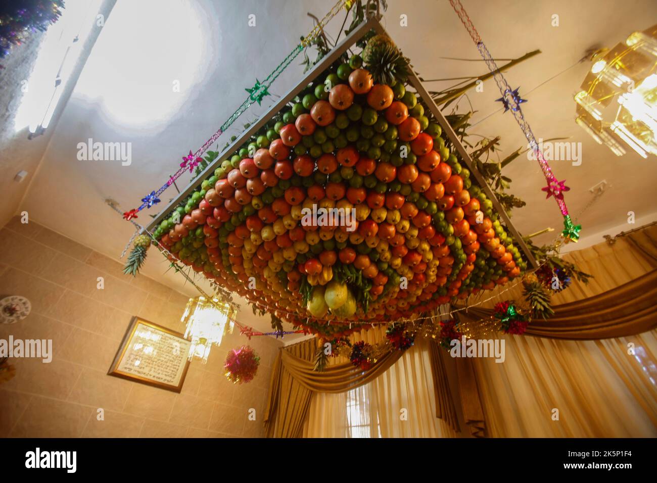 View of the traditional ritual hut decorated with fruits and vegetables ...