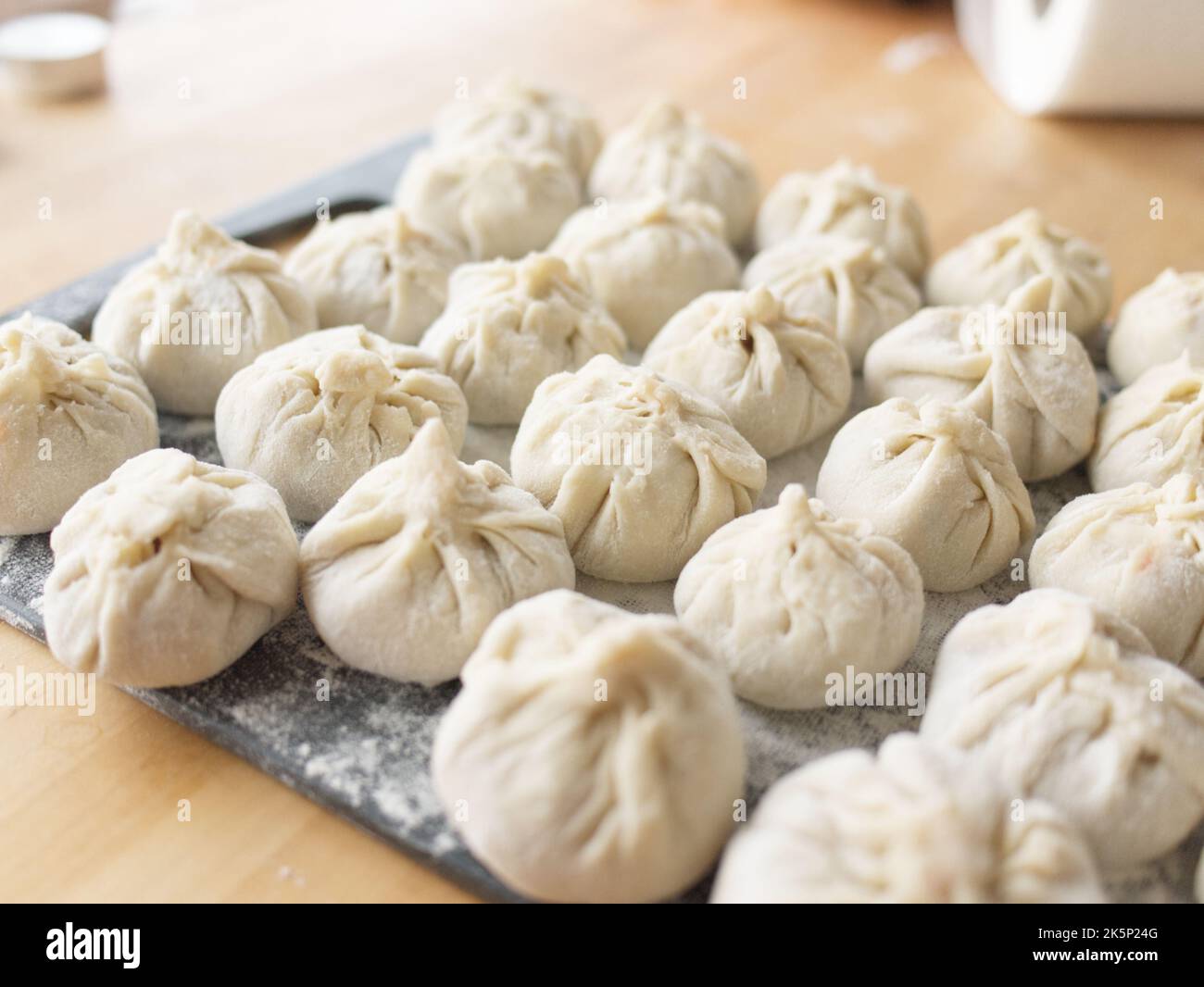 Raw dim sum on a tray Stock Photo - Alamy