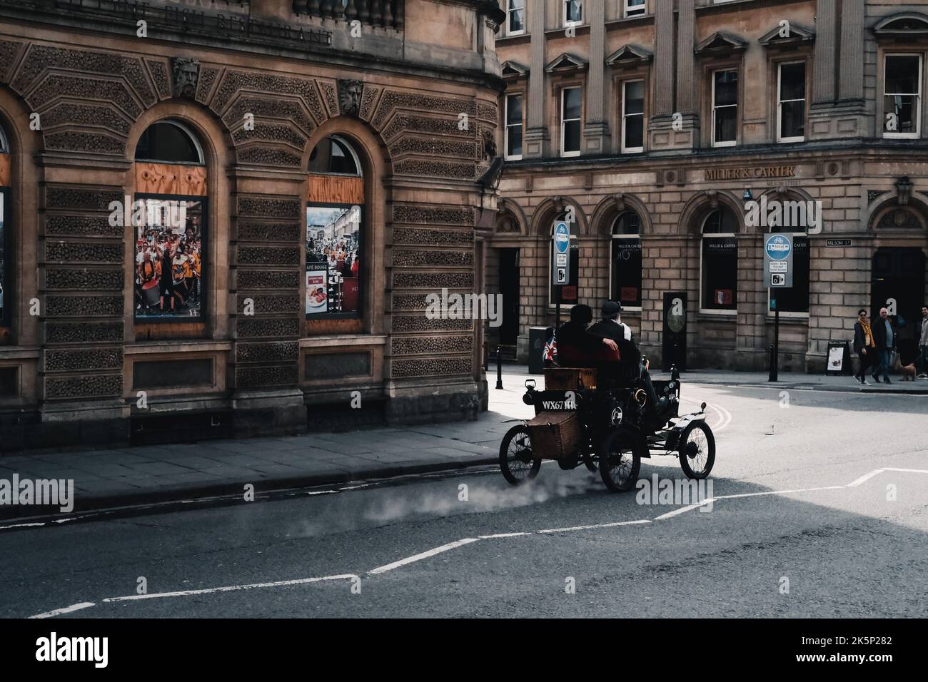 An old vintage car chugging along the streets of Bath Stock Photo - Alamy