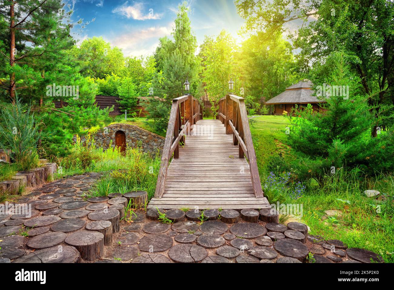 Wooden decorative bridge in the estate with landscaping in day Stock ...