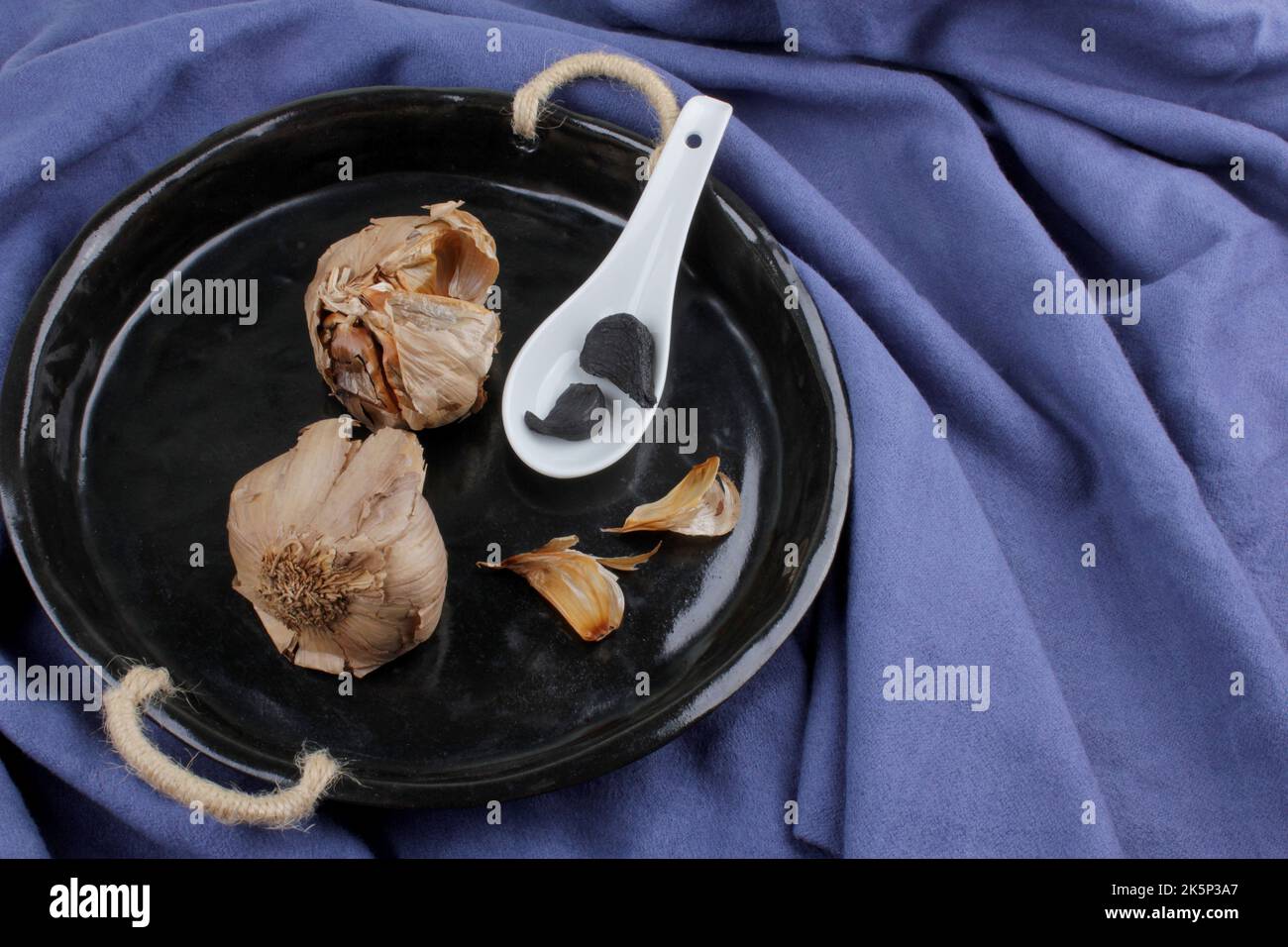 Black garlic made by fermenting process. Fermented foods. Healthy food ...