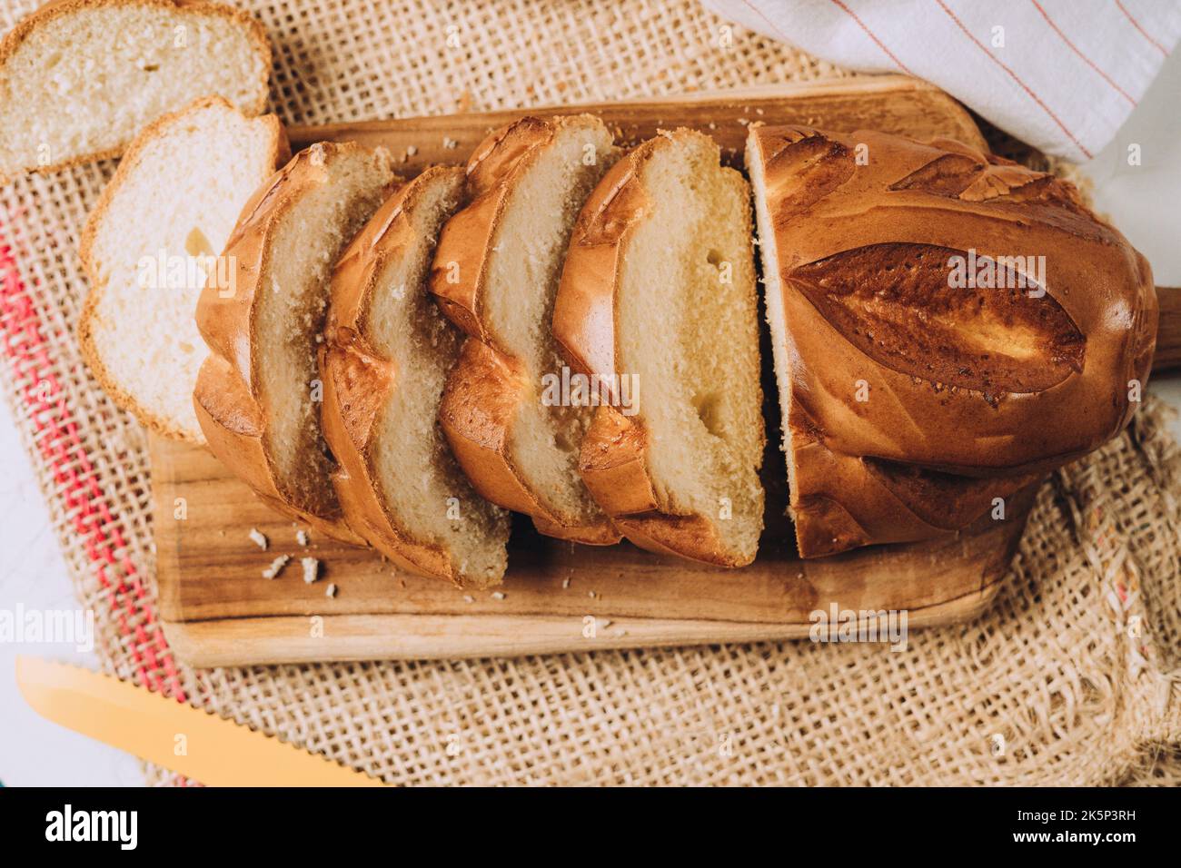 A Closeup of sliced sweet bread loaf on a white surface Stock Photo - Alamy