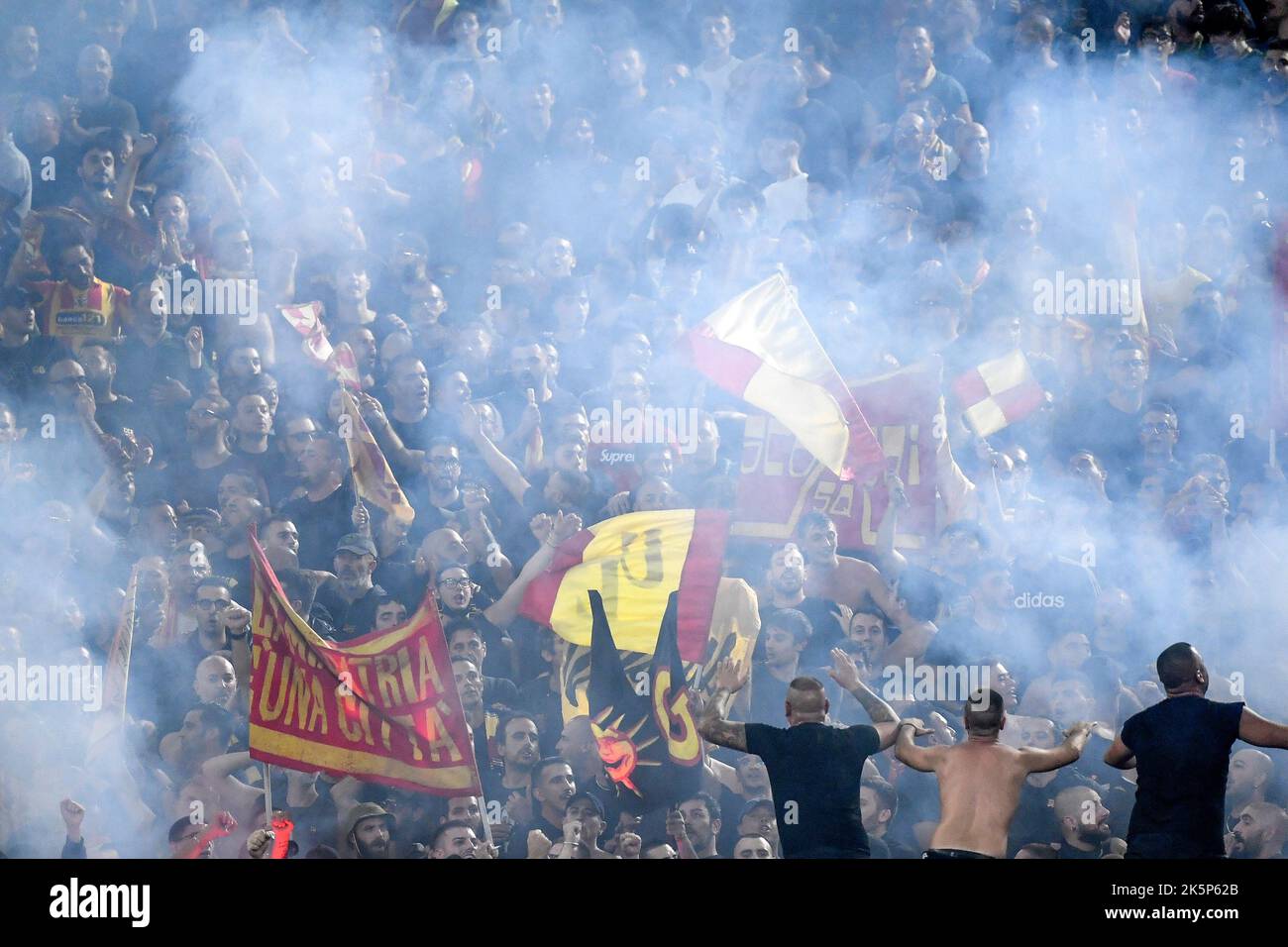 Roma, Italy. 09th Oct, 2022. Lecce fans cheer on and light smoke bombs ...