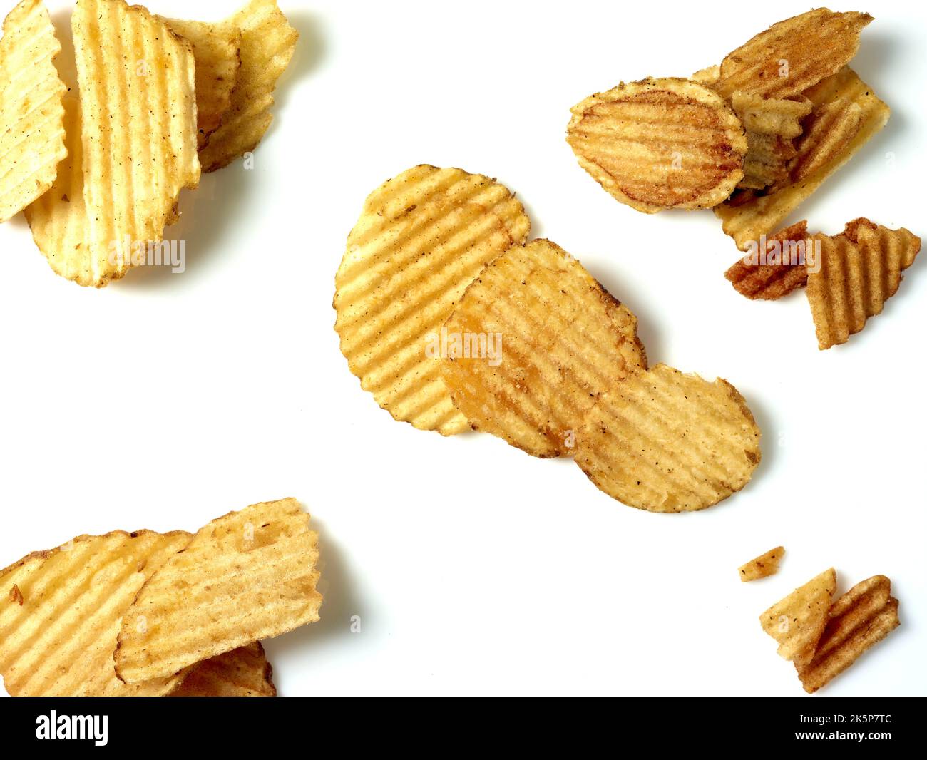 Food snack still-life of Crinkle cut crisps on plain background Stock ...