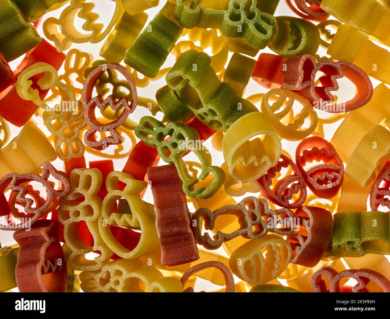 Food ingredient still-life of Tricolour, Easter Pasta Shapes in close ...