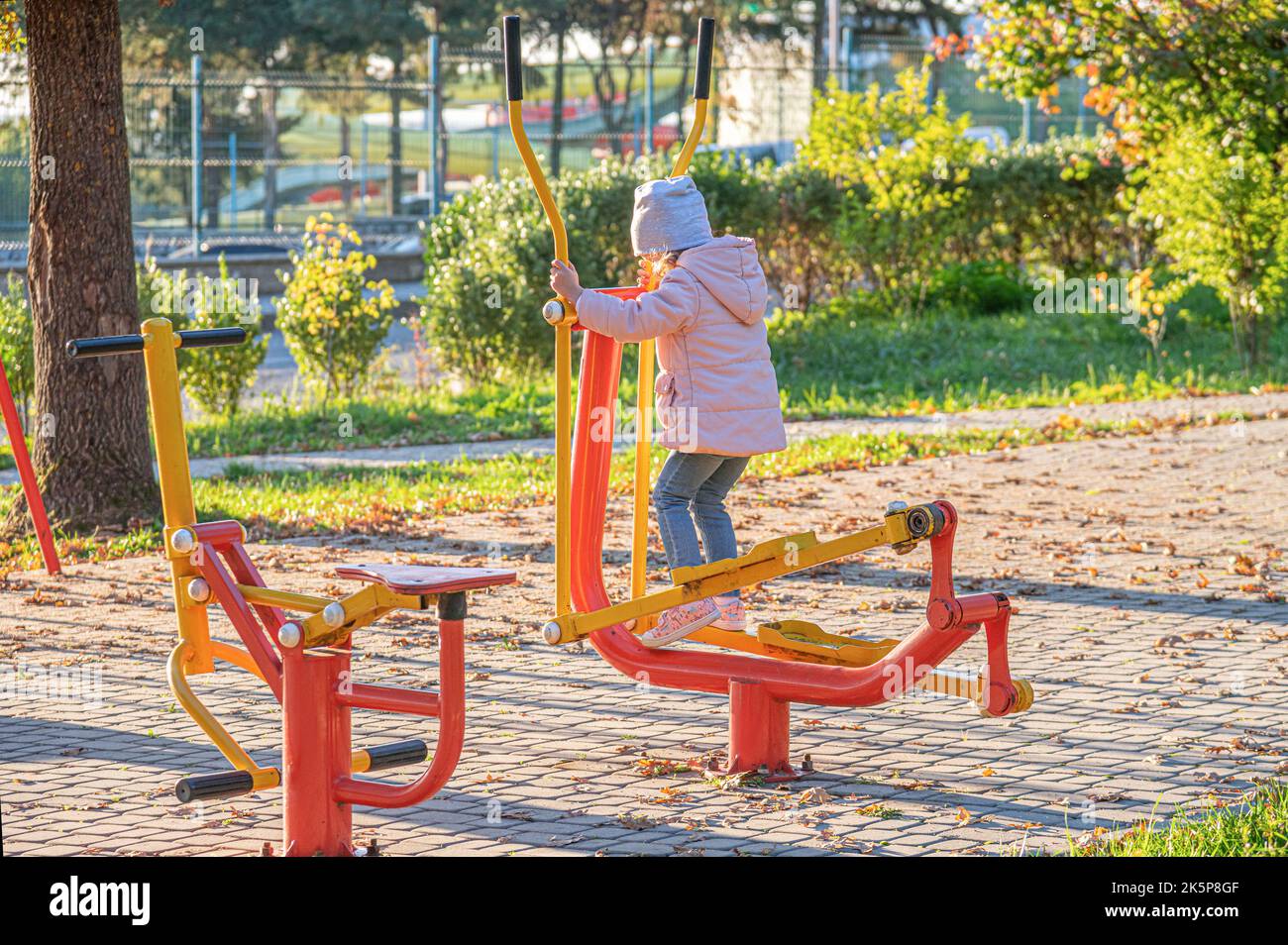 A small child on a children's playground Stock Photo - Alamy