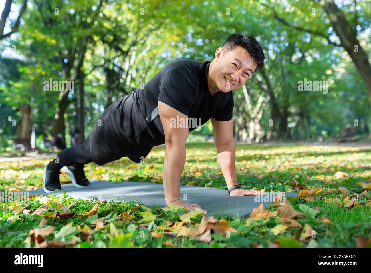 Portrait of happy male athlete, Asian looking at camera and smiling ...