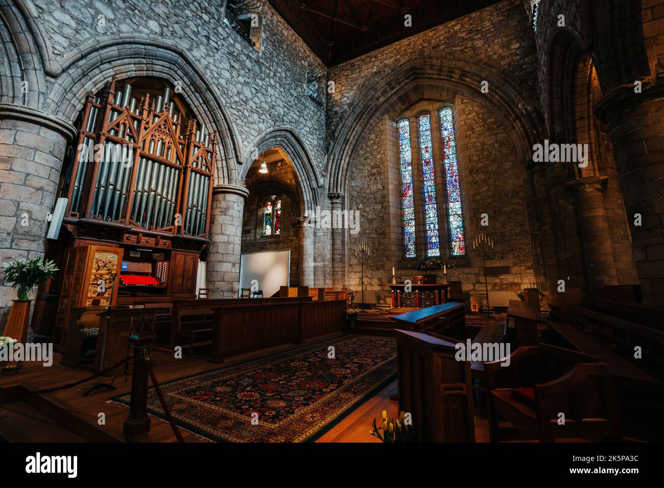 The interior of Ancient Church Cathedral with pillars, arches, and ...