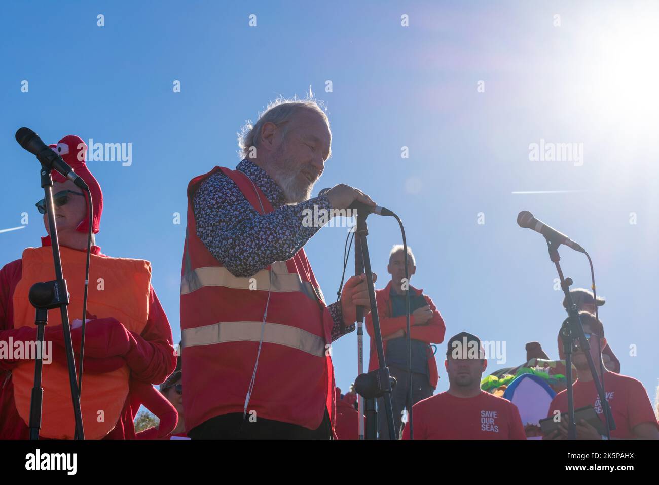 A speaker at a protest against discharges of sewage into the sea by ...