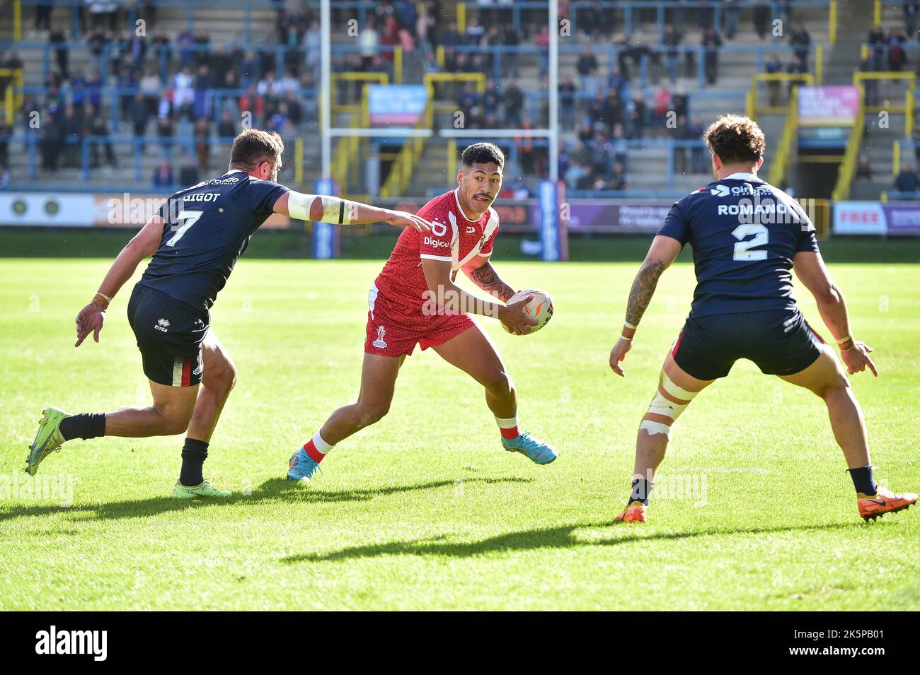 Halifax, England -8th October 2022 - Junior Amone of Tonga attempts to ...